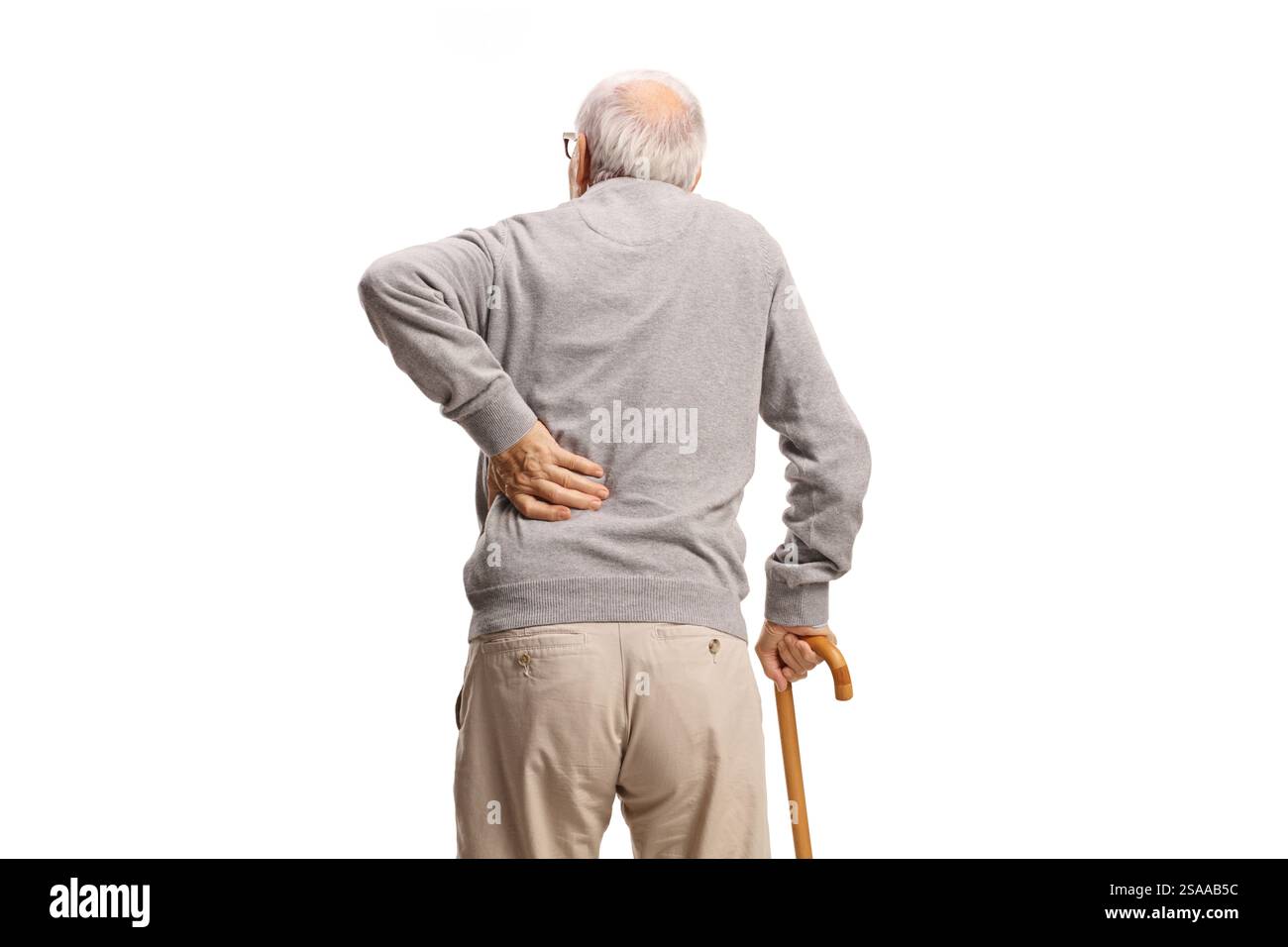 Rear view shot of a senior man in pain holding his lower back isolated ...