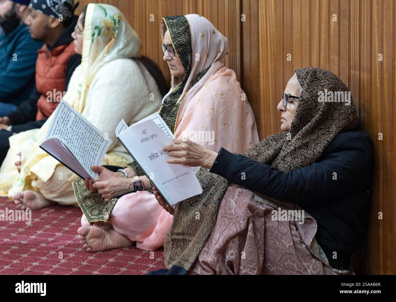 At a morning service Sikh priests read the entirety of their bible ...