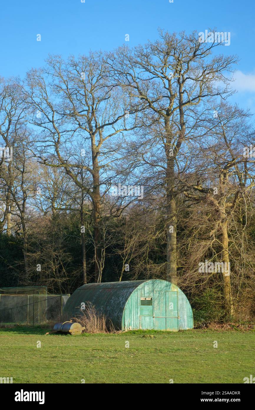 A green painted corrugated iron Second World War Nissen Hut by the ...