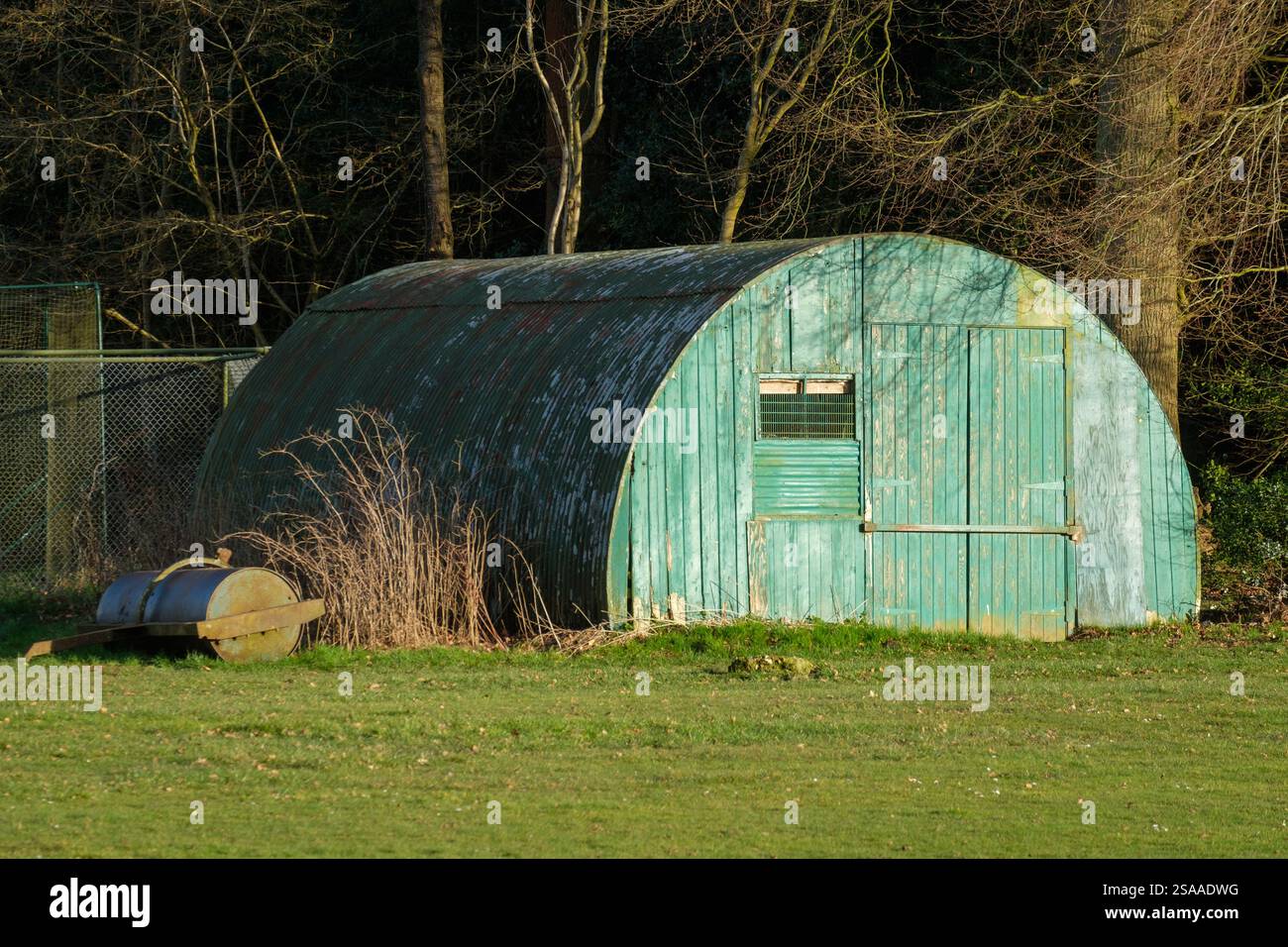 A green painted corrugated iron Second World War Nissen Hut by the ...