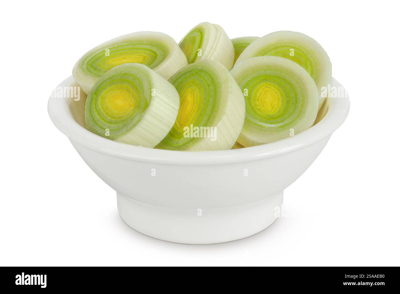 sliced Leek vegetable in ceramic bowl isolated on white background with ...