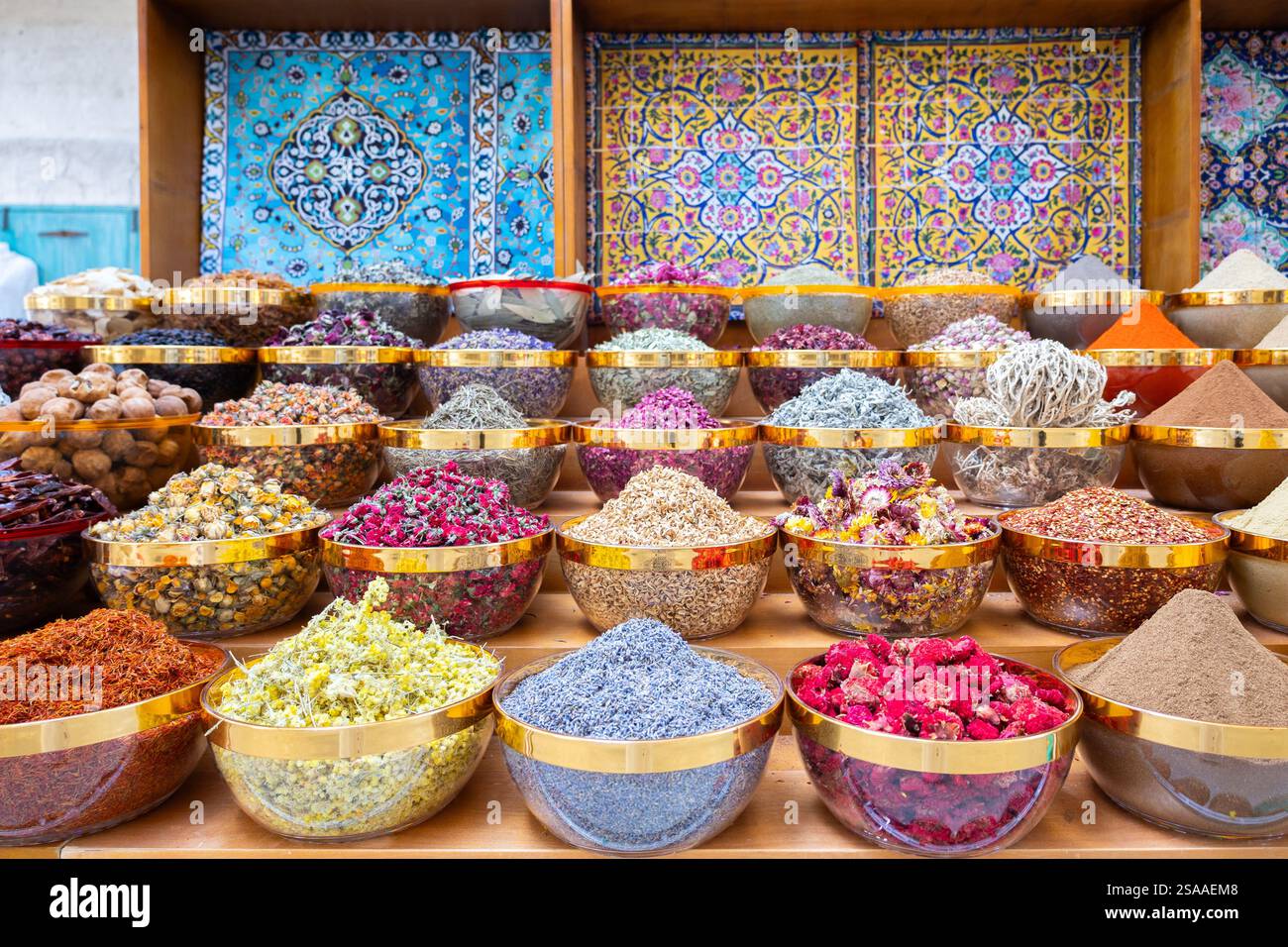 Traditional spices market. Pots and wooden tubs stand in row with ...