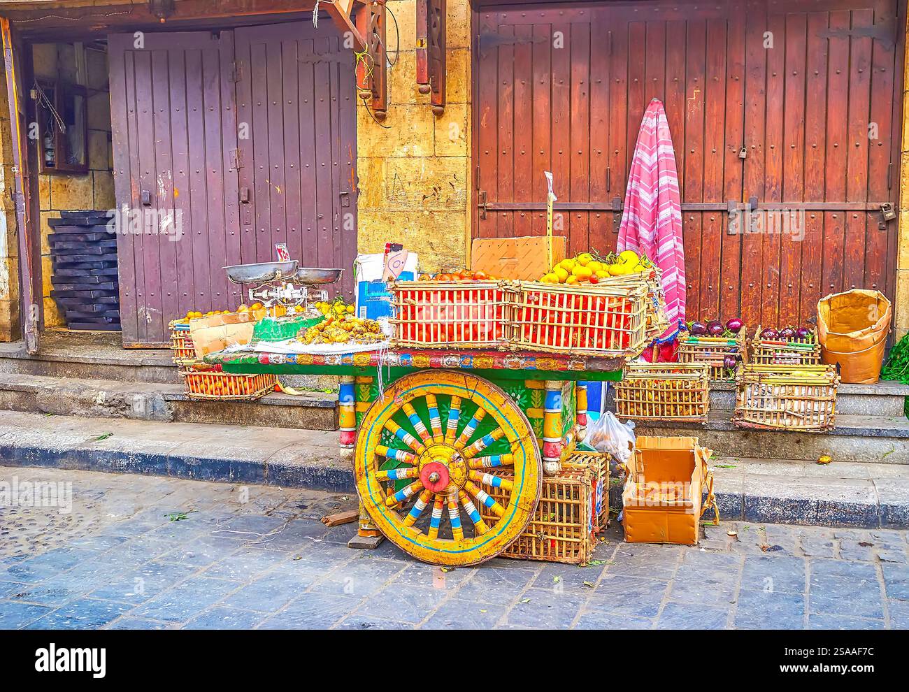 The small grocery cart with variety of vegetables and fruits in the ...