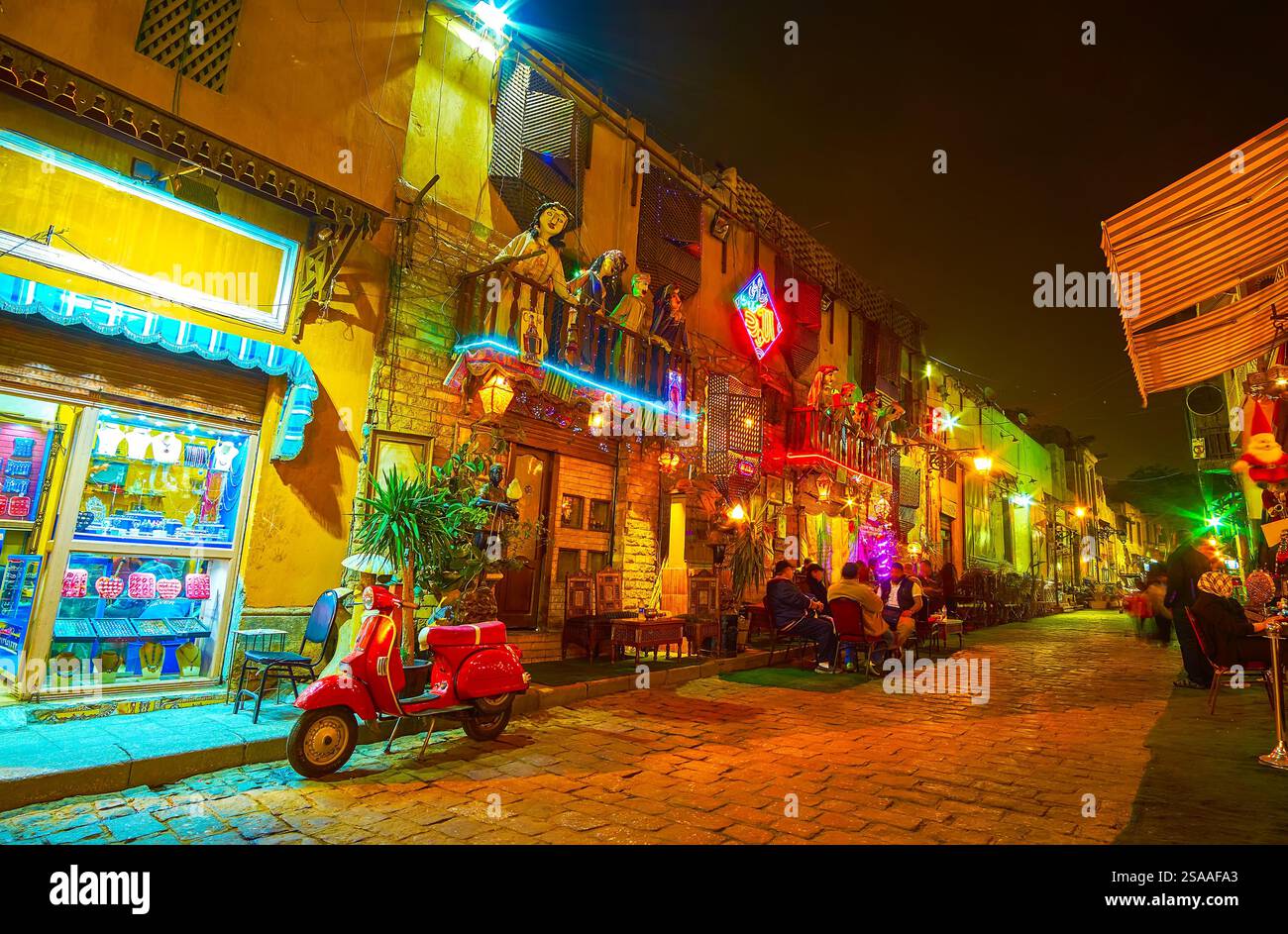 Late evening walk in Islamic Cairo, with a view of an alley of Al Muizz ...