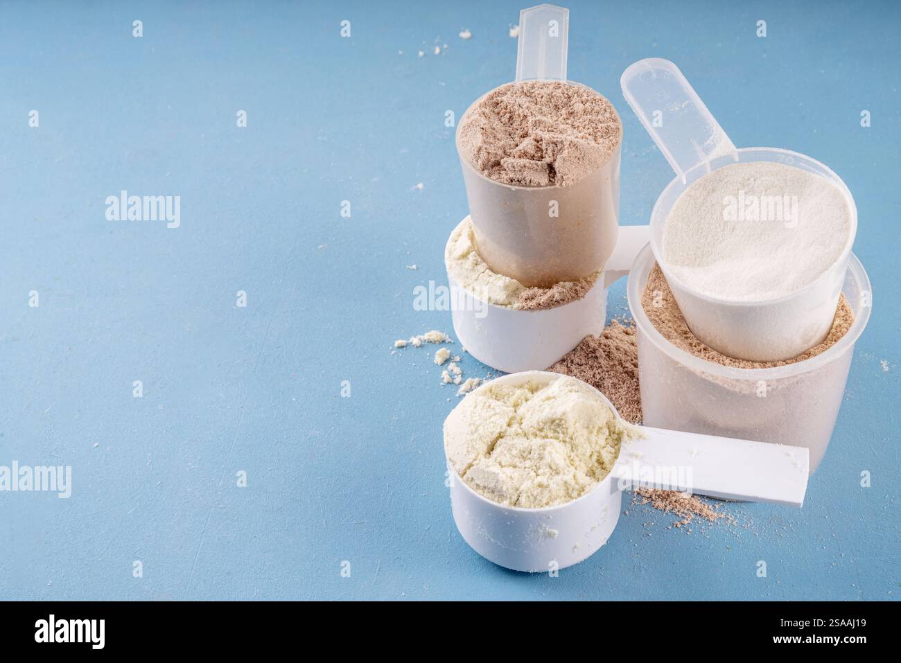 Different protein flavors in plastic scoops. Protein powder shakes for ...