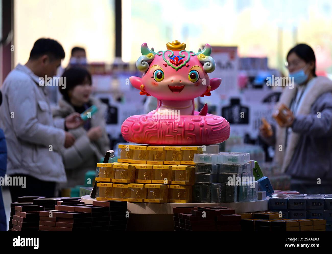 Hefei, China's Anhui Province. 29th Jan, 2025. Tourists buy souvenirs ...