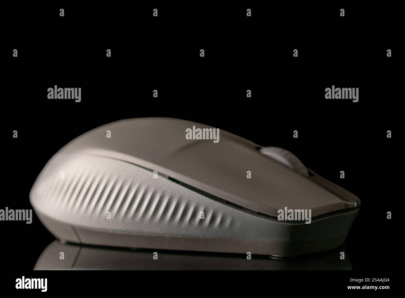 One wireless computer mouse, macro, isolated on a black background ...