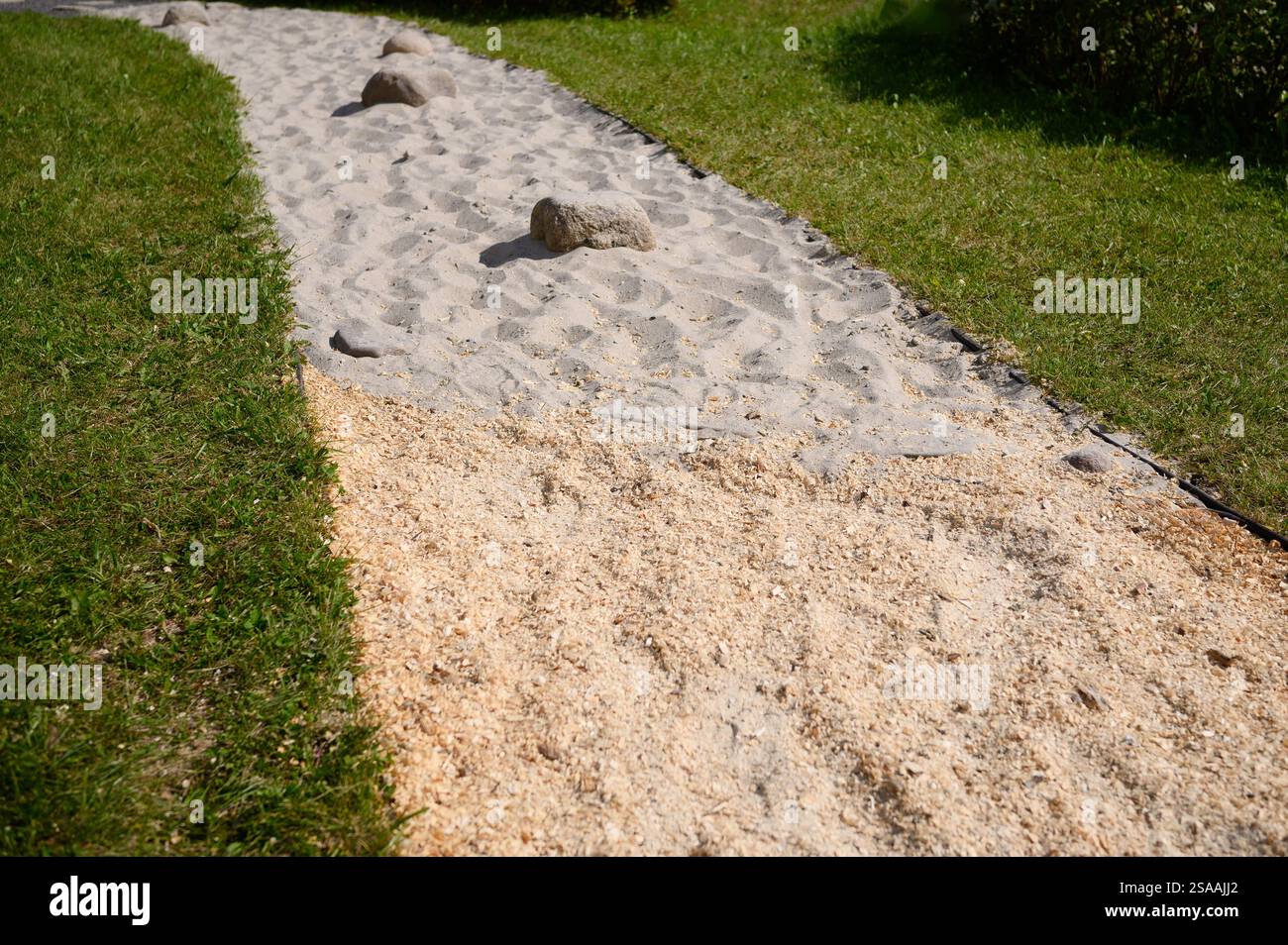 Barefoot path in public park. Tactile massage eco-path with different ...