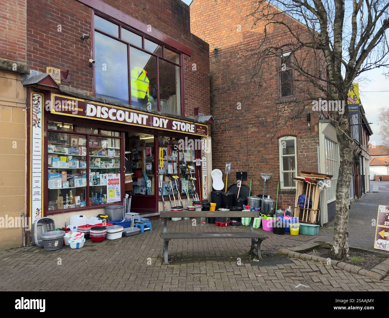 Traditional high street Ironmongers hardware store front with goods on ...