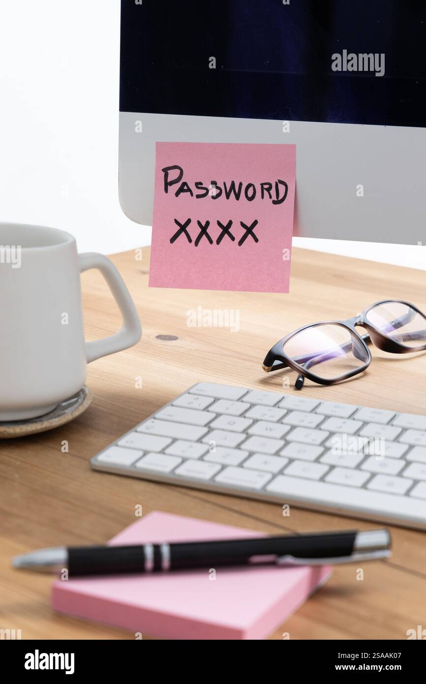 A visible sticky note with login details stuck to a computer screen ...