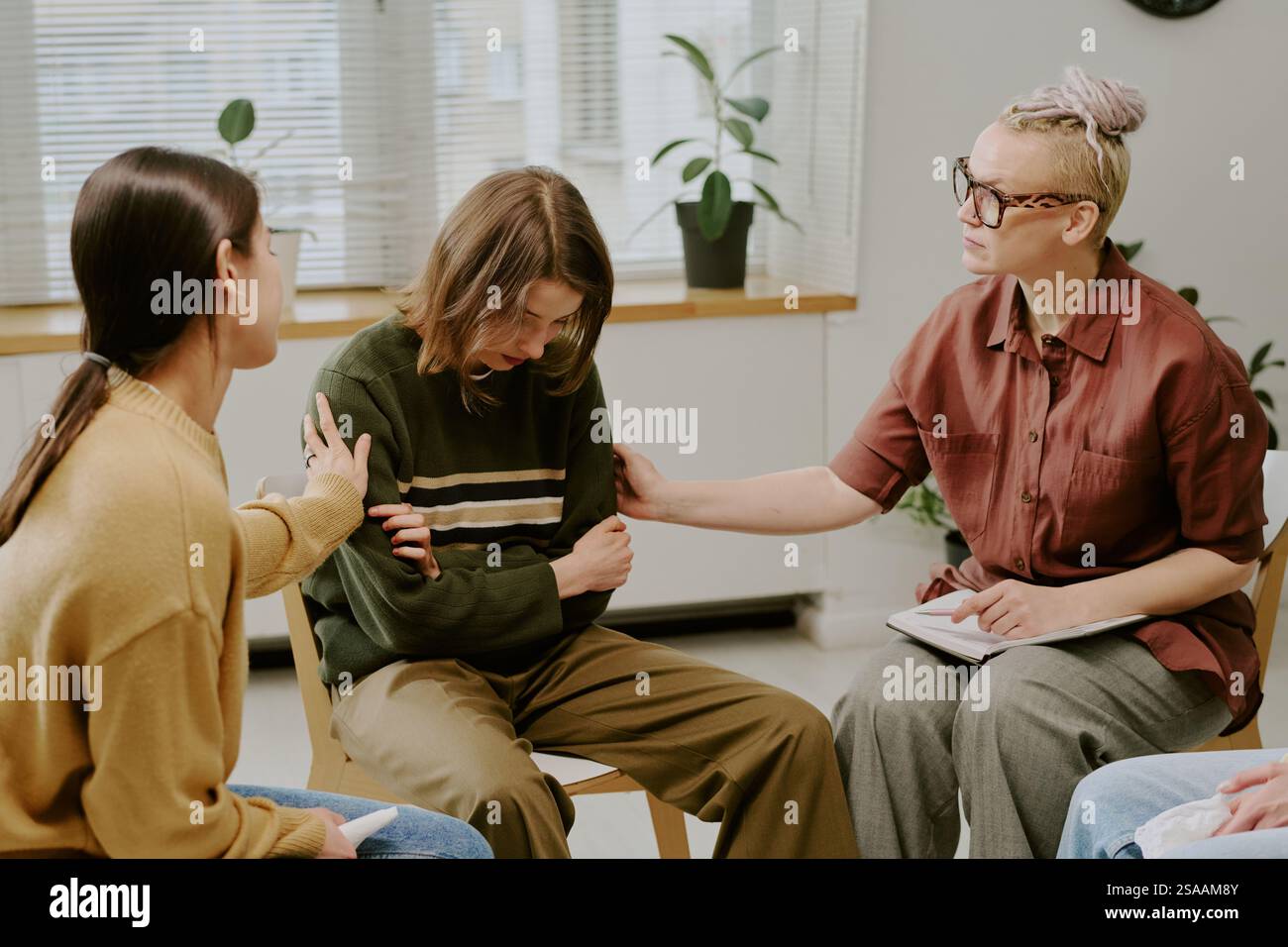 Counseling therapist sharing insights with group of young adults ...