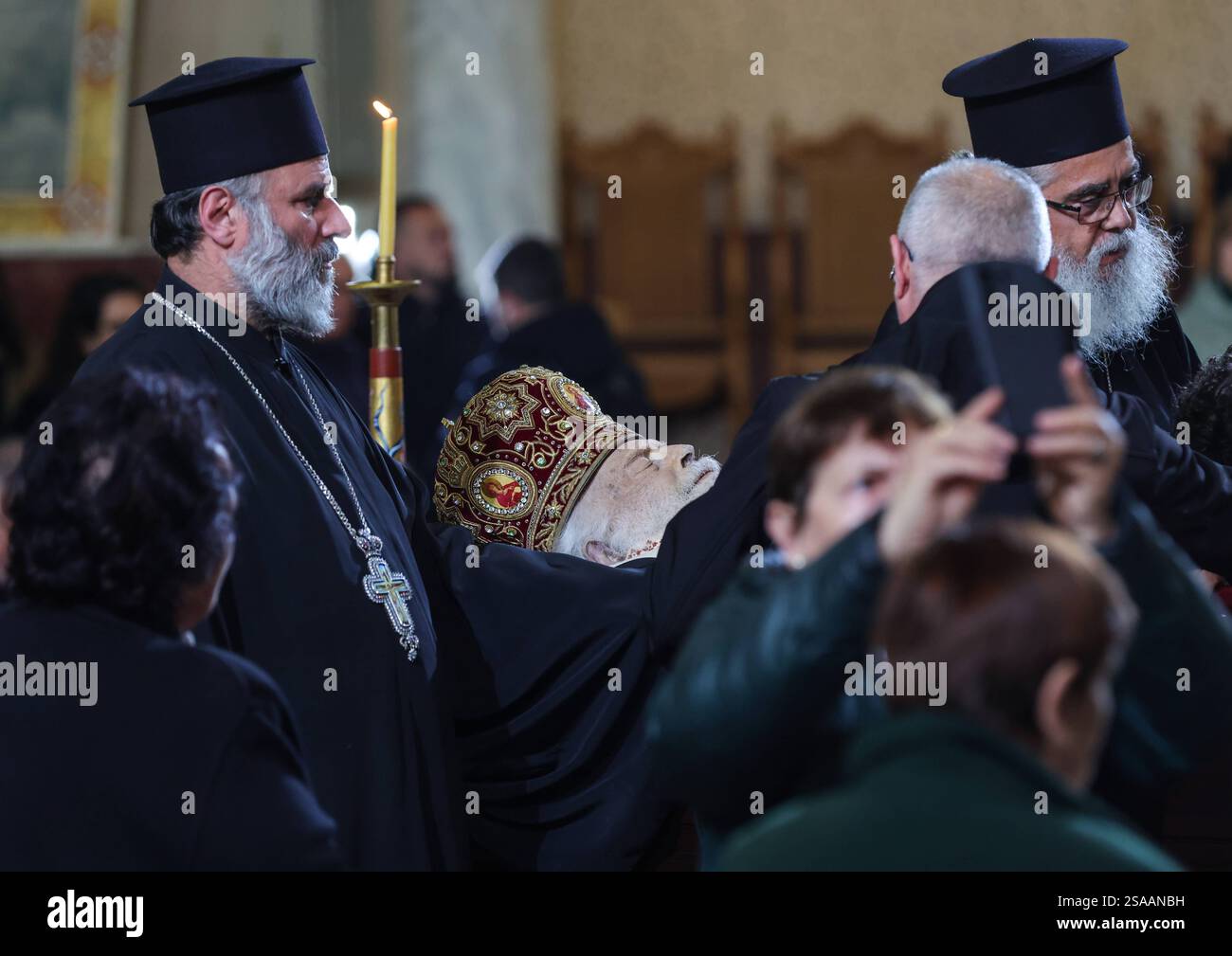 People pay tribute around the body of the late Archbishop of Tirana ...