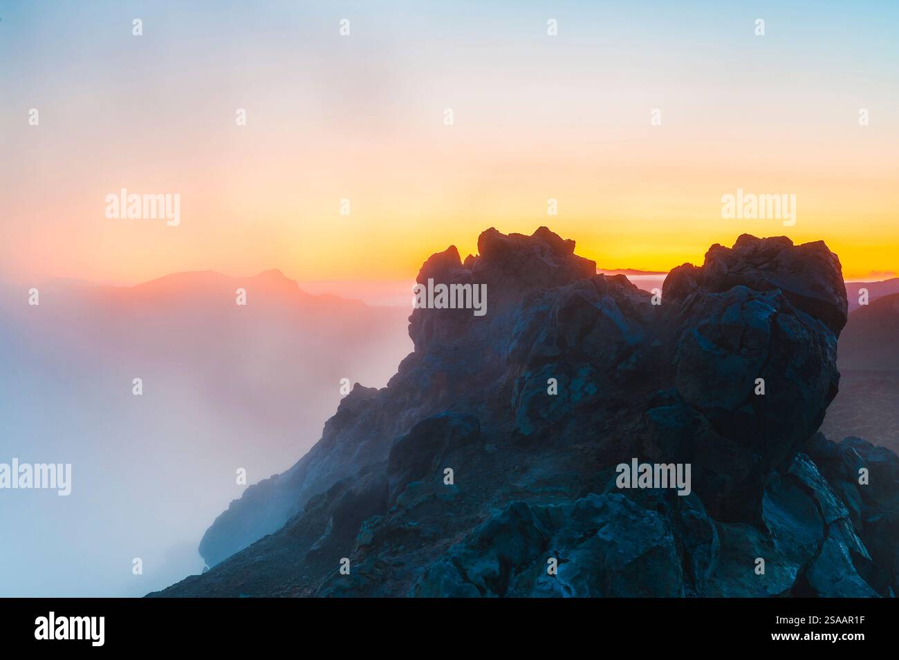 A stunning sunset displays vibrant hues, casting a warm glow over a ...