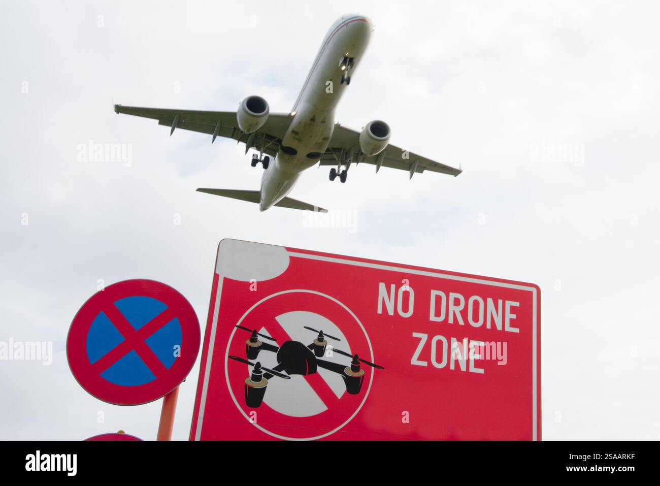 High-Flying Contradiction: Plane Passes Over 'No Drone Zone' Sign Stock ...