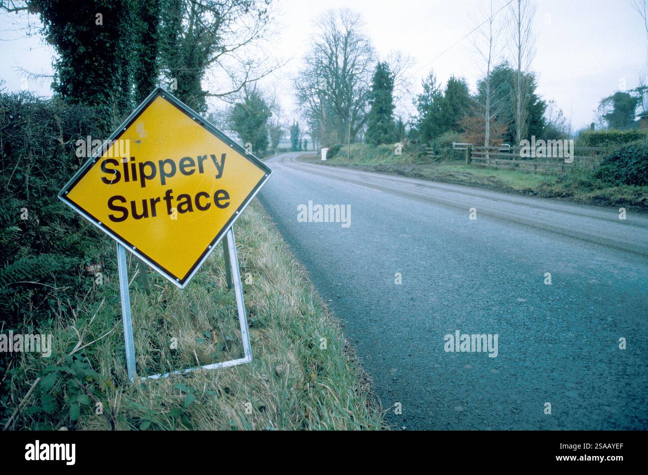 Road sign showing slippery road conditions Stock Photo - Alamy