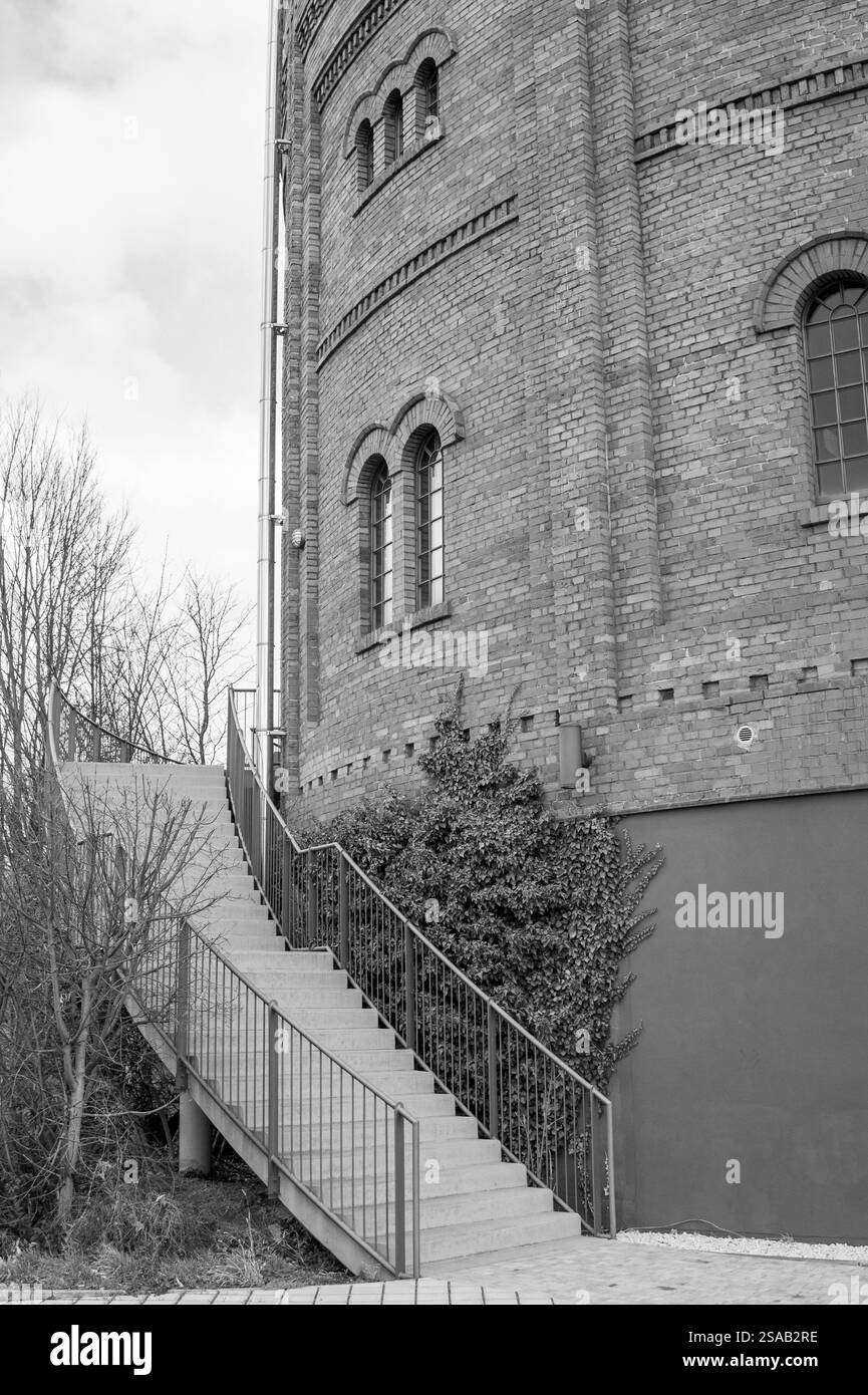 Old gasometer in Zwickau with stairs in black and white vertical ...