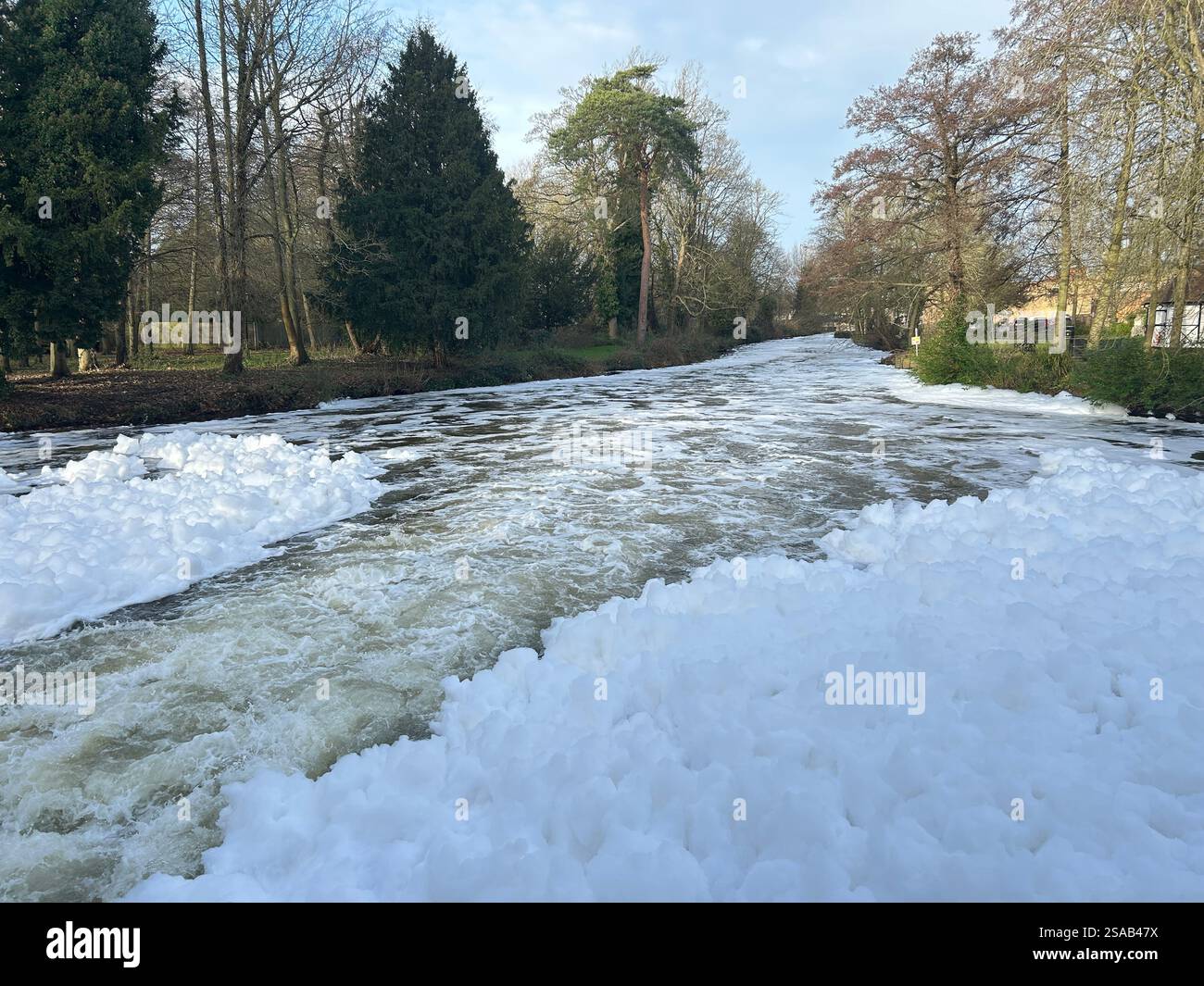 River water covered in 12 inch layer of white bubbly foam Stock Photo ...