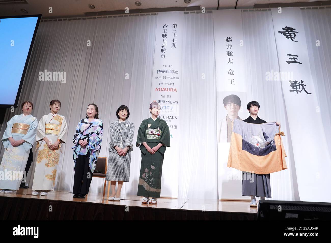 Japanese Shogi player Sota Fujii (R) attends the Ryuo inauguration ...