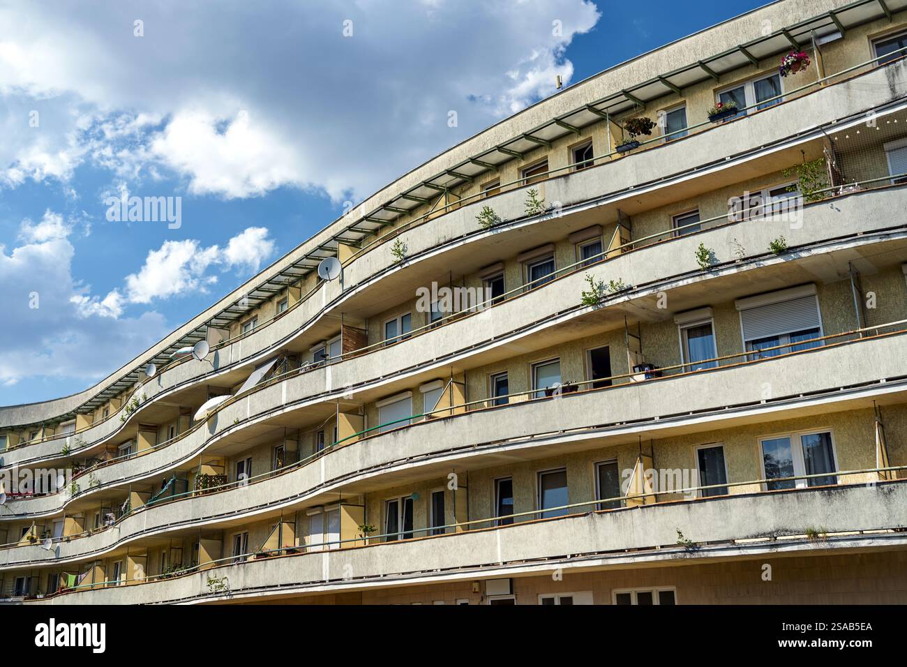 Facade of a modern residential building with wave-shaped balconies in ...