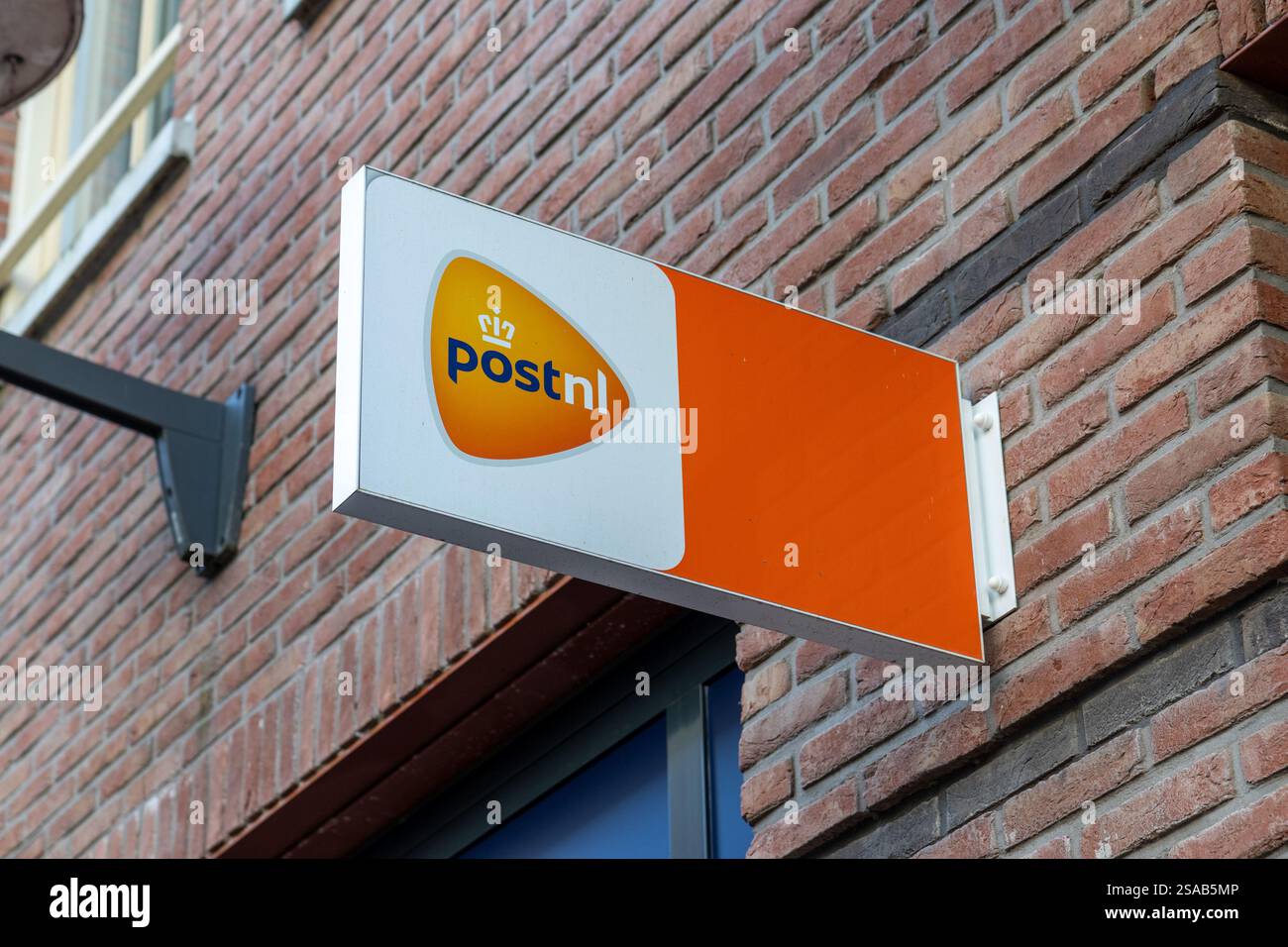 Postnl Flag sign logo at pakket punt. The national and biggest postal ...