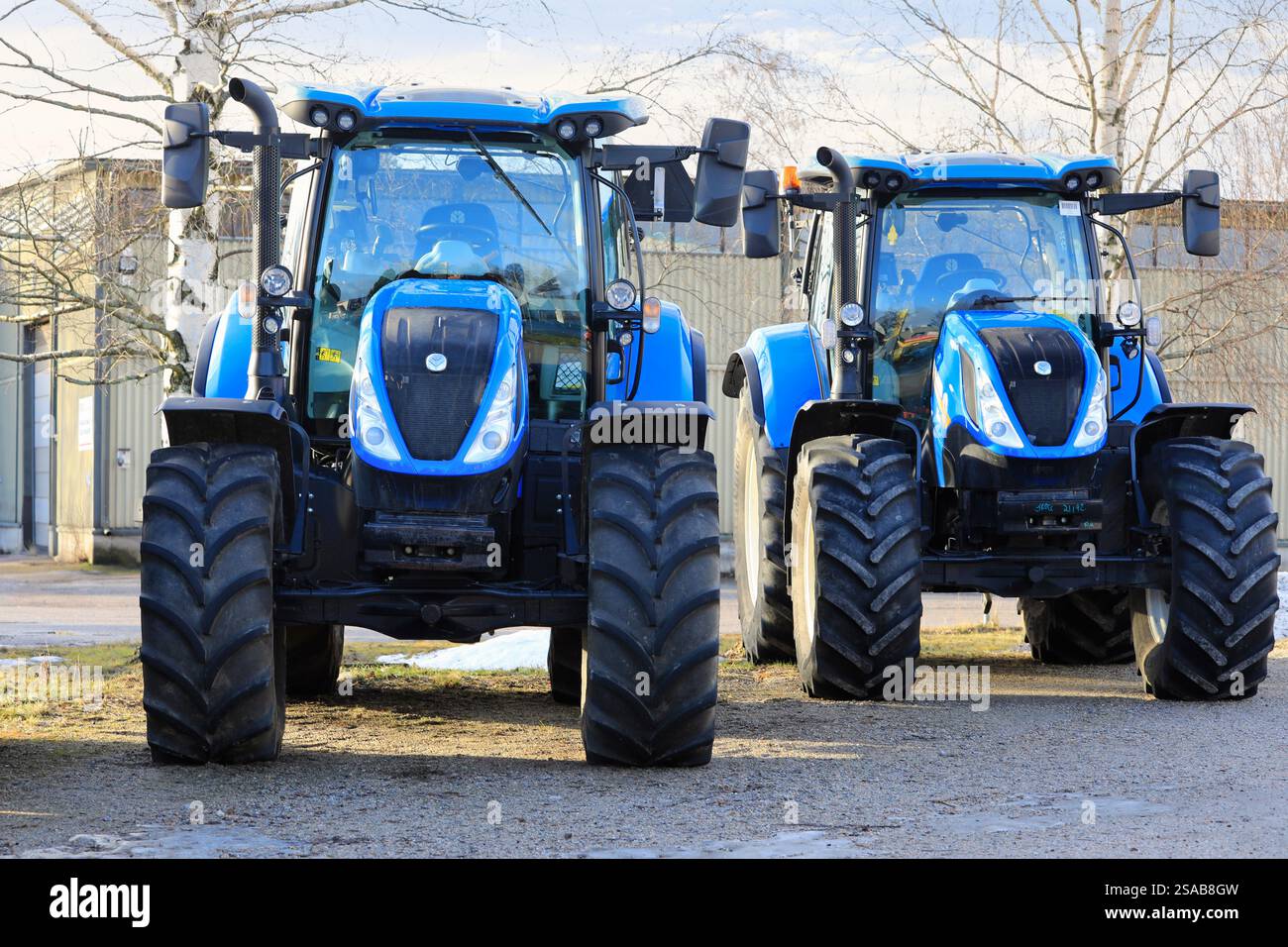 Two New Holland all-purpose tractors, left T6.175 and right T6.180 ...