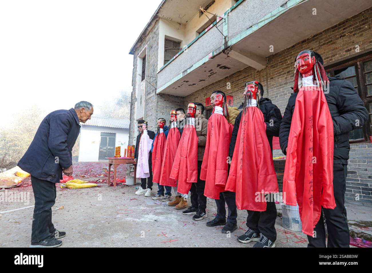 An old man commences the parade of the figureheads in the traditional ...