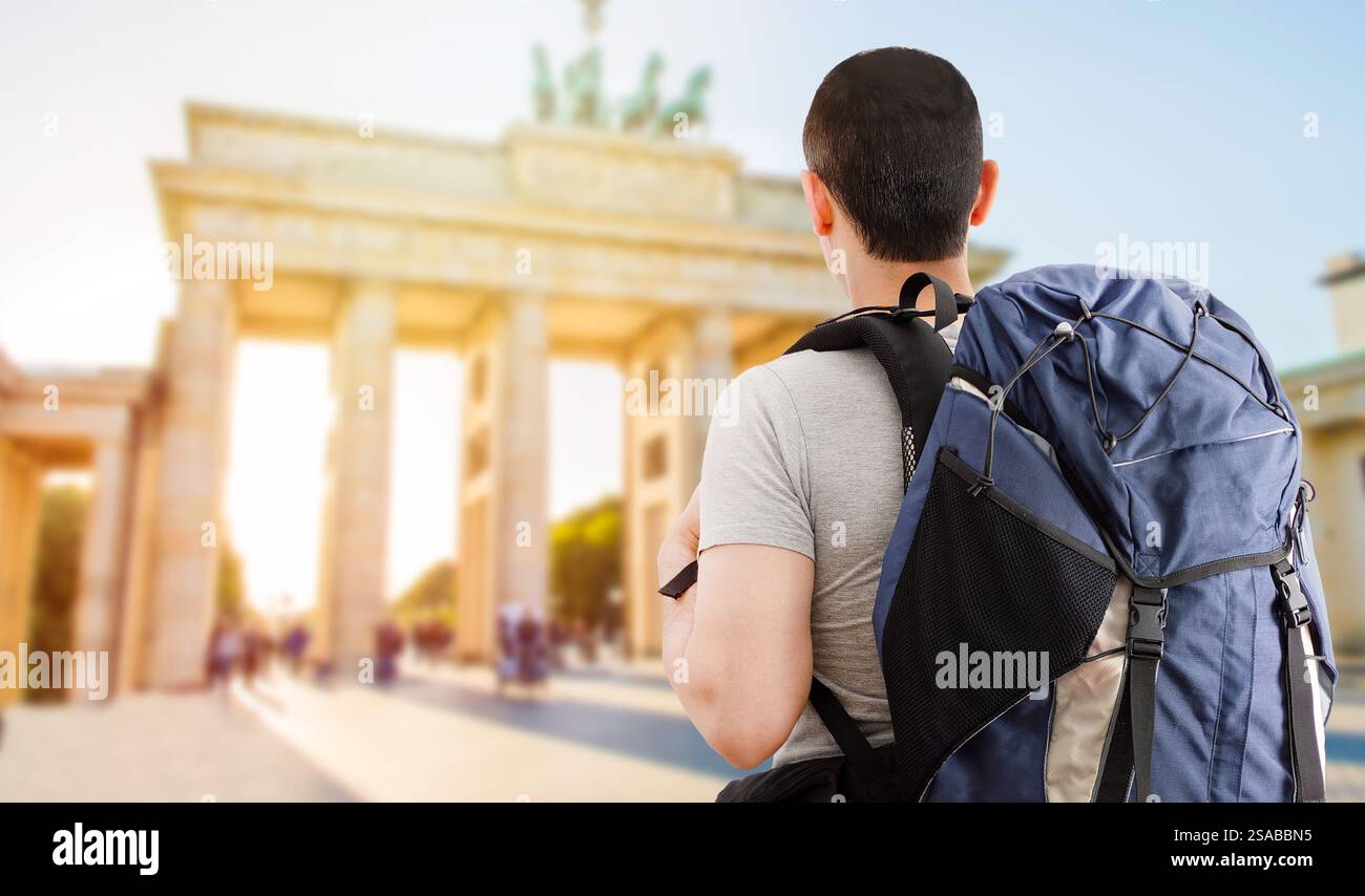 Traveler boy in europe and looking at the Brandenburg gate in Germany ...