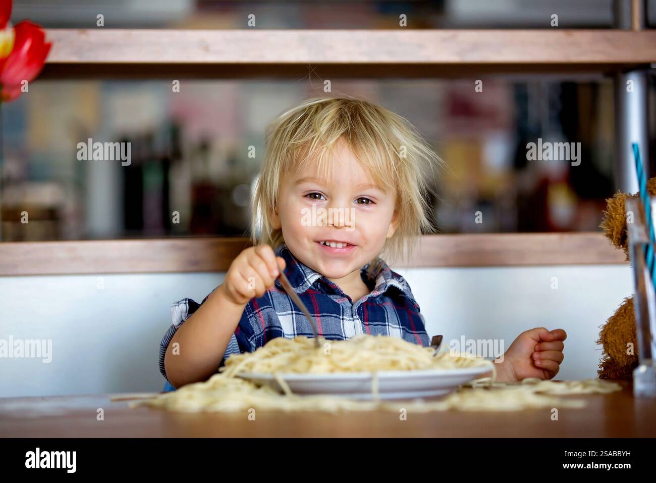 Little baby boy, toddler child, eating spaghetti for lunch and making ...