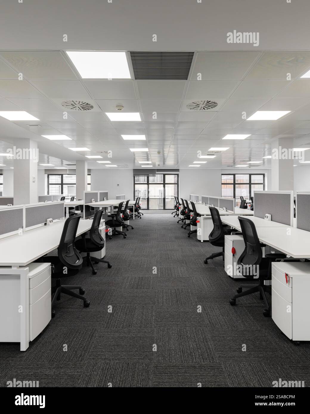 Empty open office space with modern design and ergonomic setup Stock ...