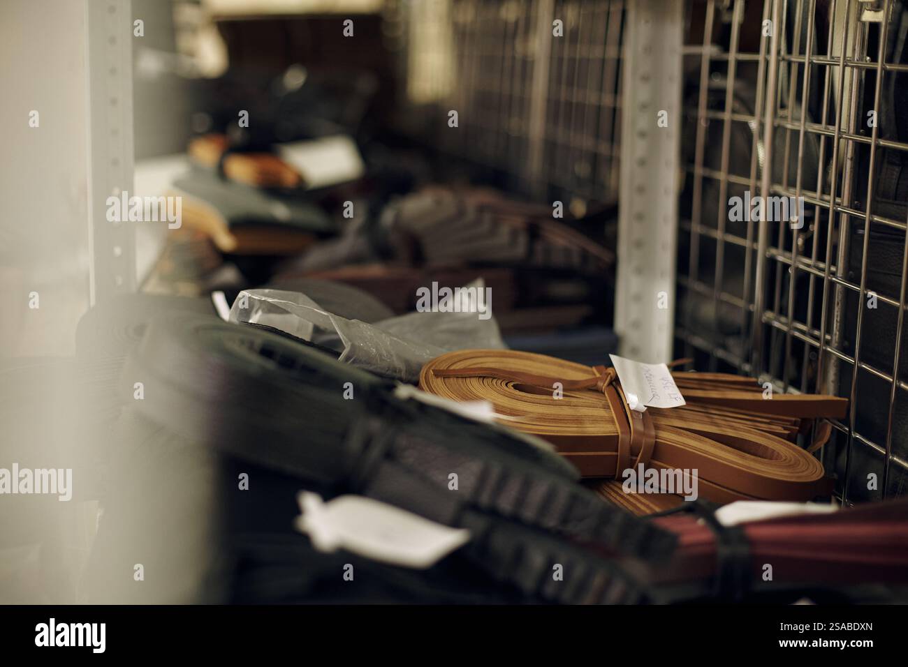 Leather straps displayed in industrial setting, showcasing different ...