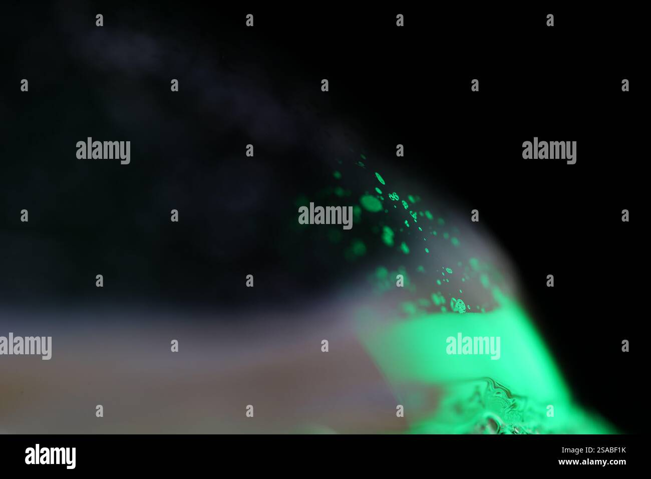 Green liquid edge on the dark background, colourful abstract, green ...