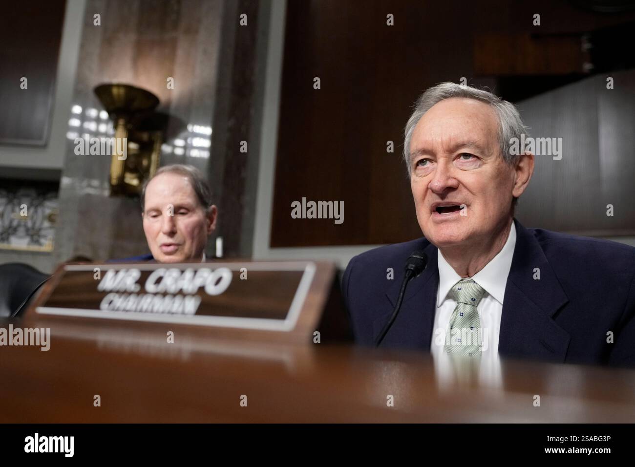 Committee Chairman Sen. Mike Crapo, R-Idaho, right, gives opening ...