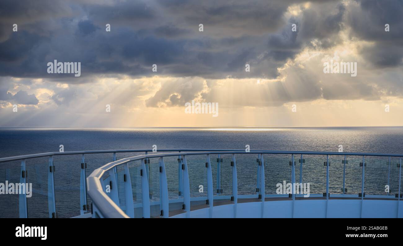 Sea on the horizon with spectacular sky taken from a cruise ship deck ...