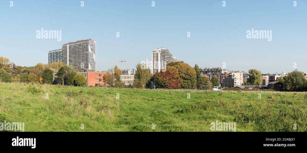 The Scheutbos with green lawns and trees with the high rise apartment ...