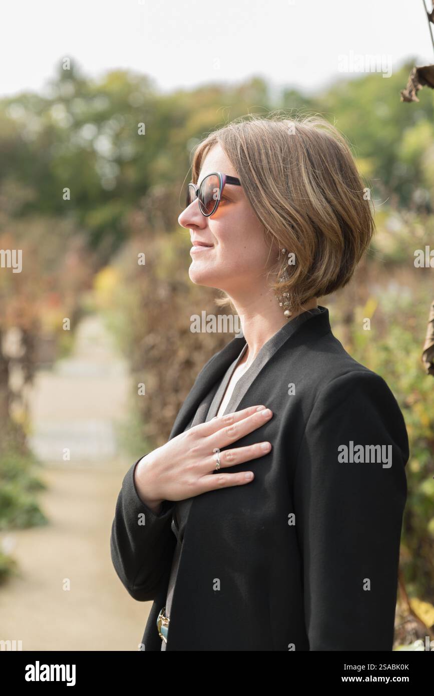 Outdoor portrait of a 31 yo woman in the Stuyvenberg Royal city park ...