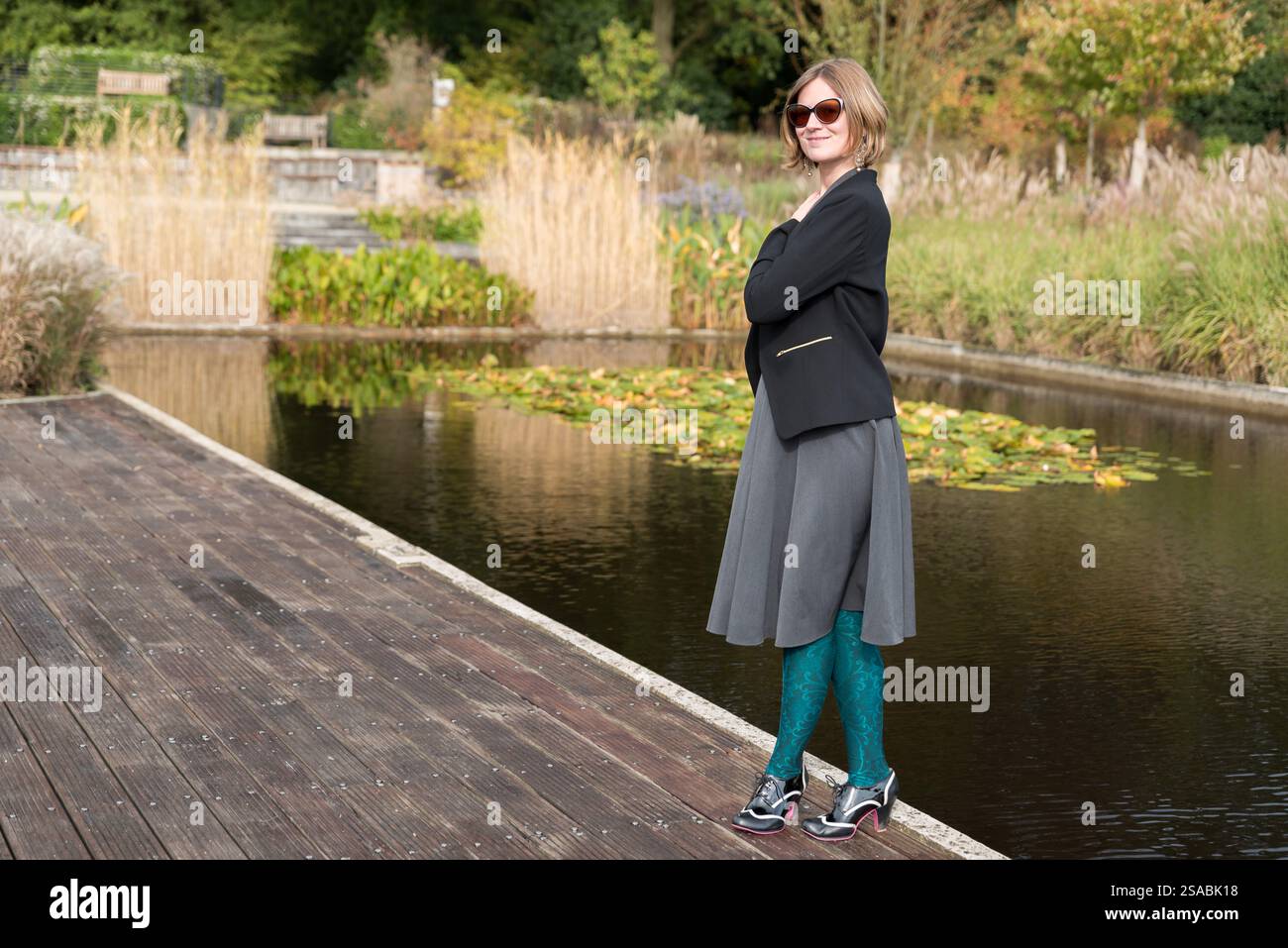Outdoor portrait of a 31 yo woman in the Stuyvenberg Royal city park ...
