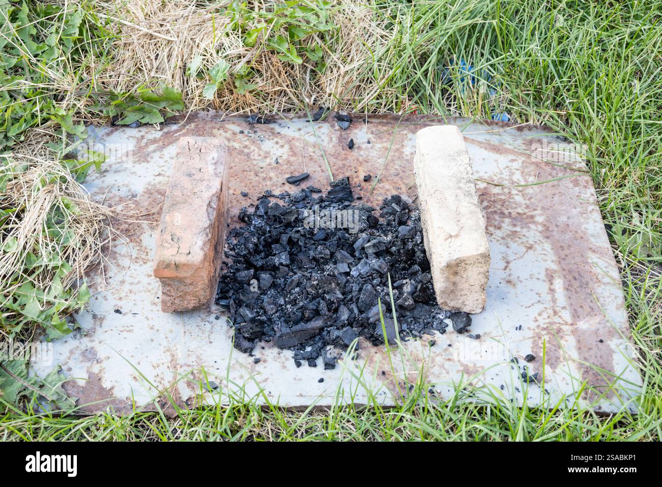 Bricks and coal for prepare and roasting on a fire in nature. Homemade ...