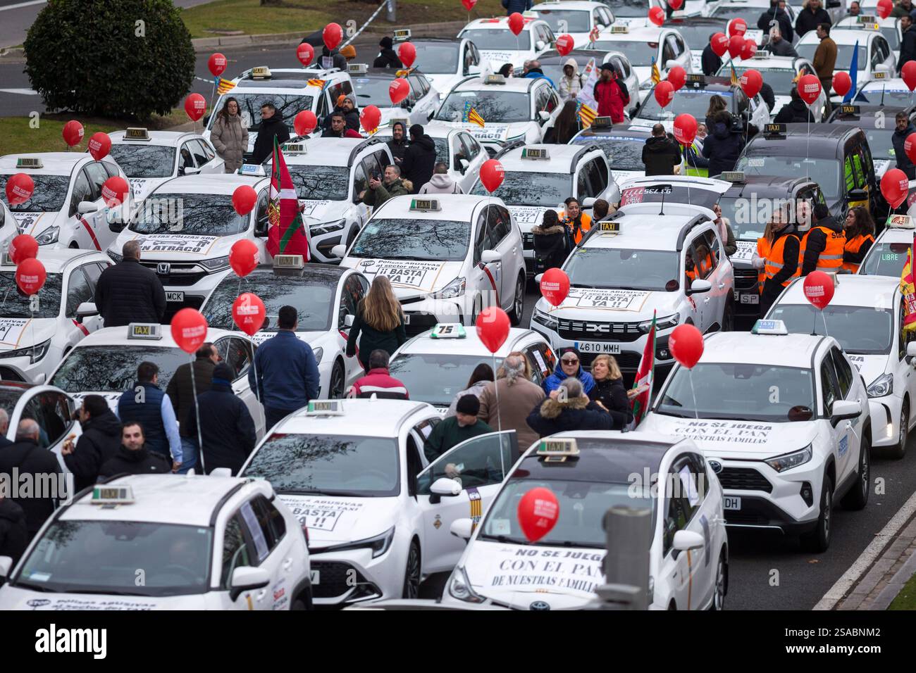 Taxi drivers with flags and red balloons on their vehicles seen during ...