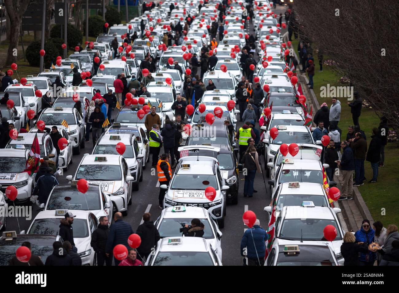 Taxi drivers with flags and red balloons on their vehicles seen during ...