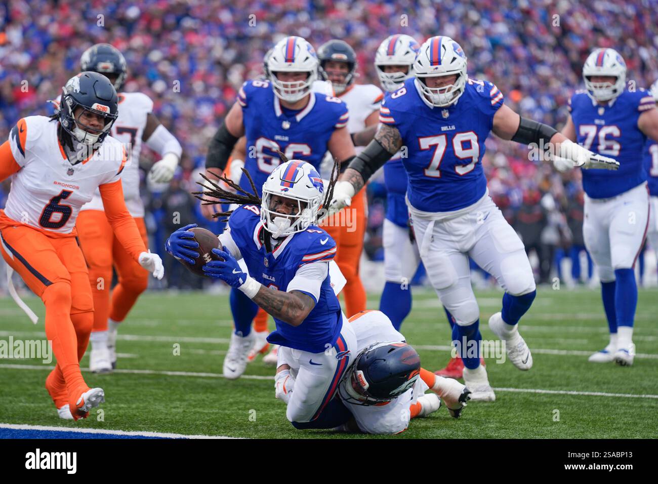Buffalo Bills' James Cook scores a touchdown an NFL football game ...