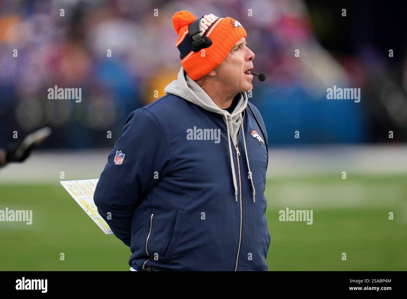 Denver Broncos head coach Sean Payton looks over the field during an ...