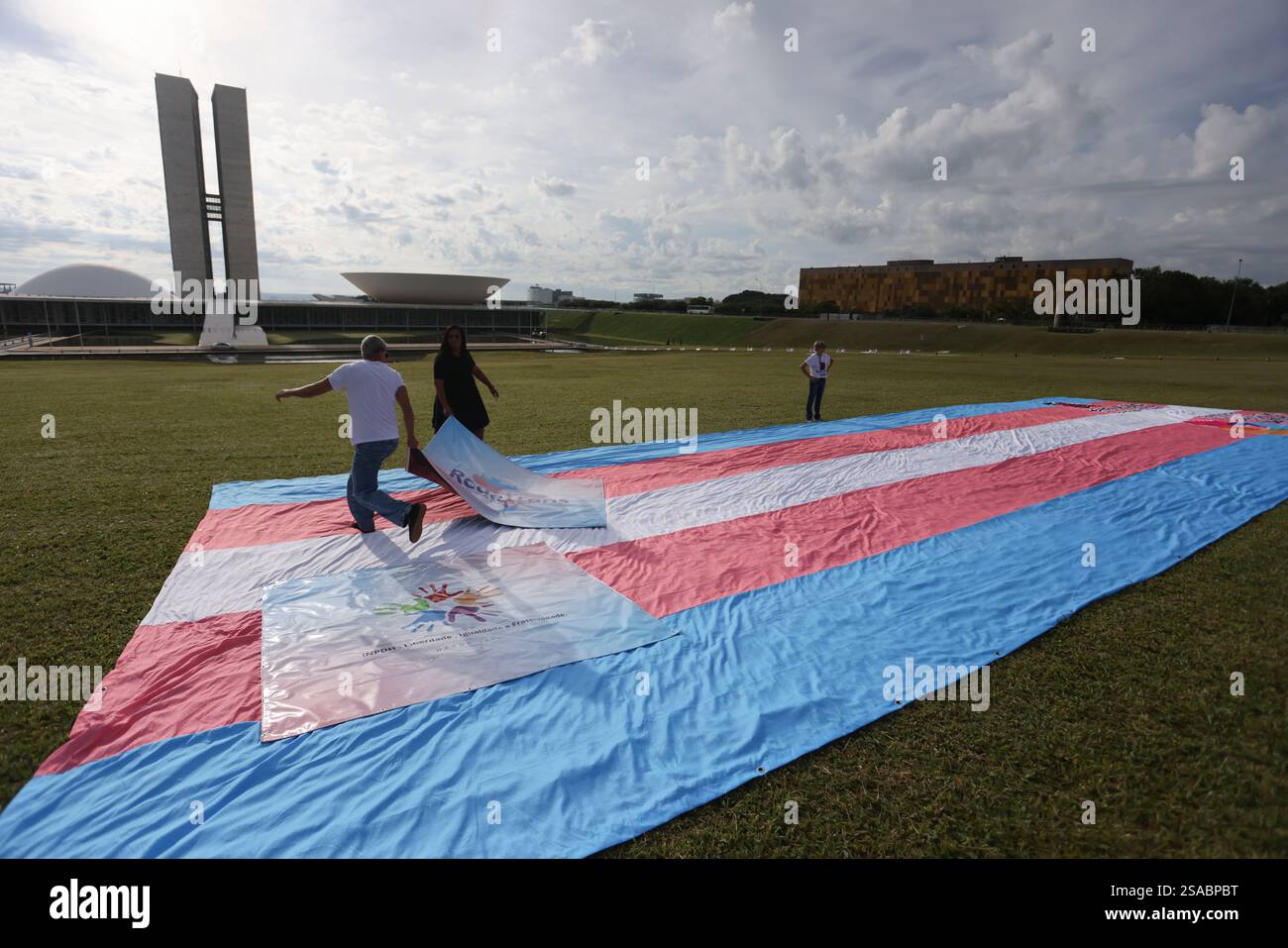 People place a transgender flag outside Congress on Transgender Day of ...