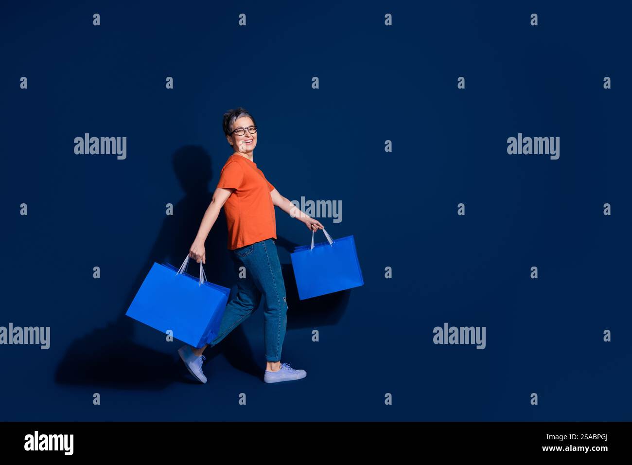 Full body photo of attractive senior woman profile walk shopaholic ...