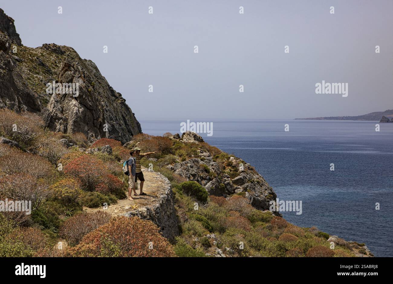 Hikers on the Sarella peninsula near Plakias, south coast, Crete ...