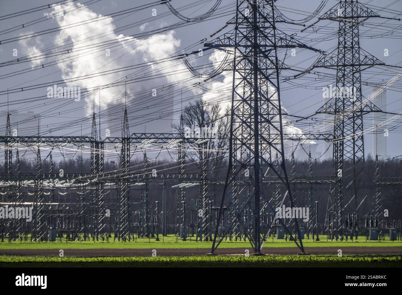 RWE Power lignite-fired power plant Niederaussem, high-voltage pylons ...