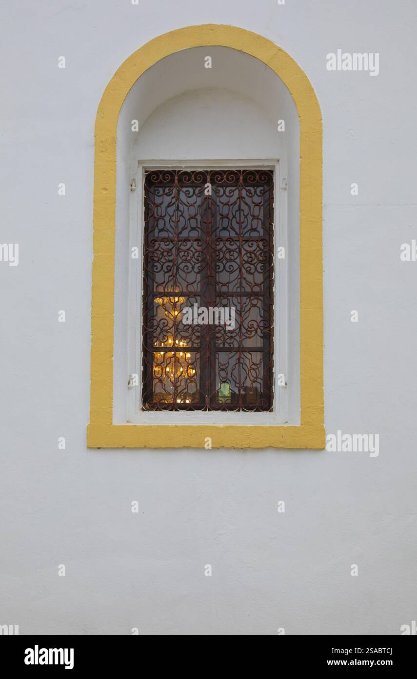 Mountain village Lakkoi with Agios Antonios church, church window ...