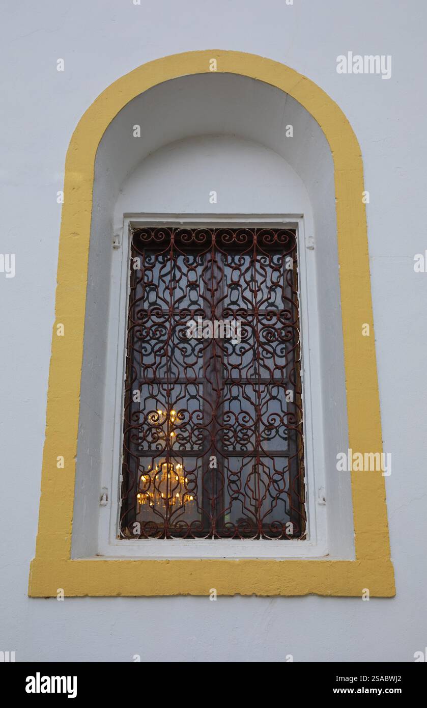 Mountain village Lakkoi with Agios Antonios church, church window ...