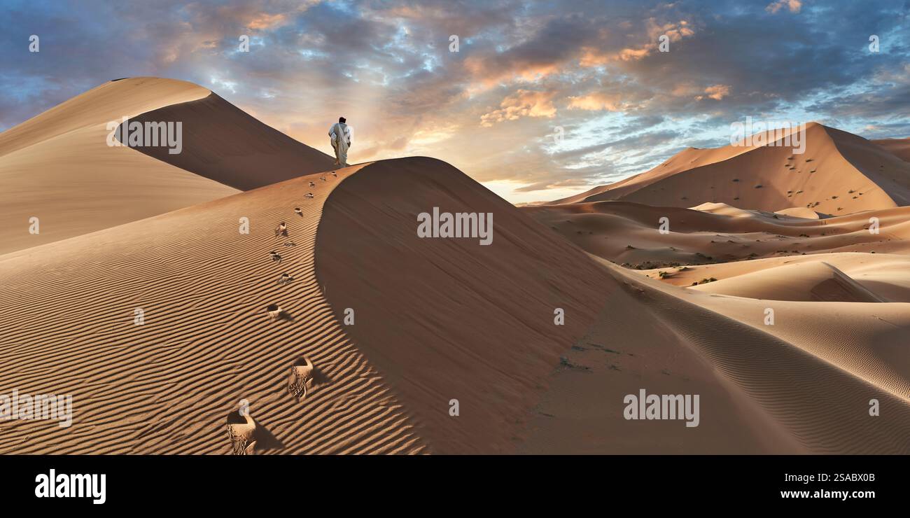 Berber man walking in the Erg Chebbi Sahara sand sune belt, Merzouga ...