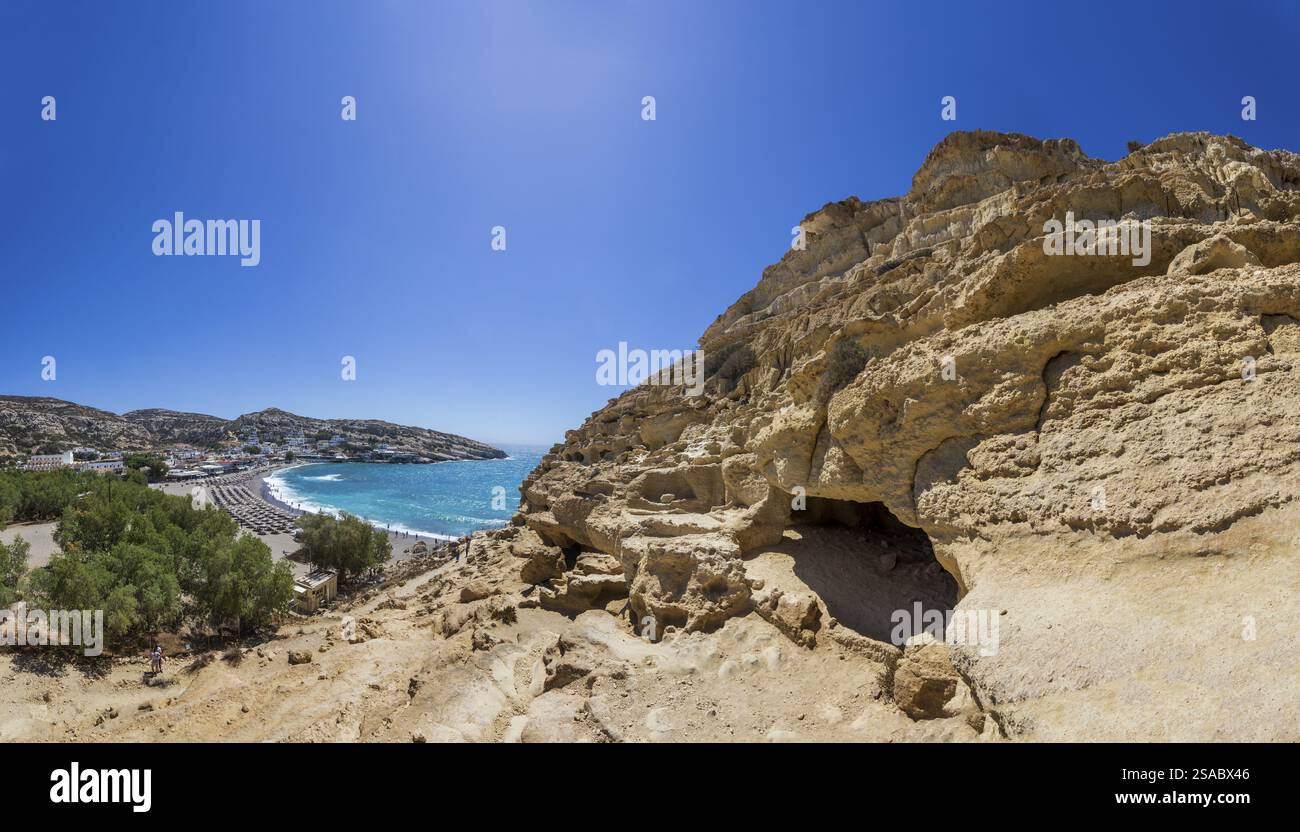 View from the rock caves to the beach of Matala, south coast, Crete ...