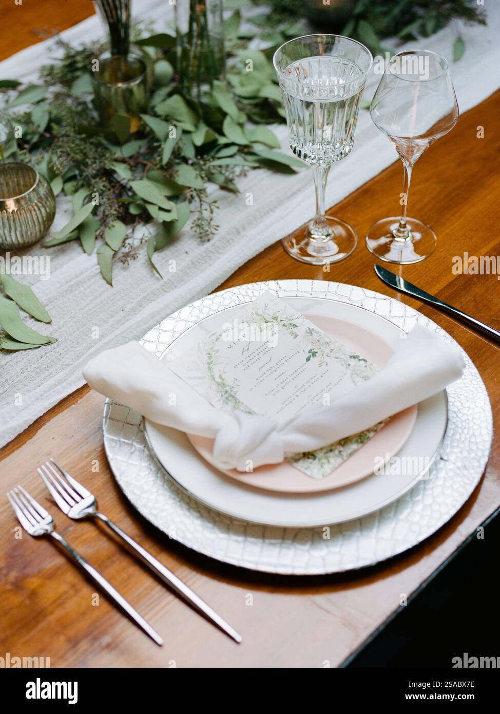 A beautifully arranged dining table displays fine china and sparkling ...
